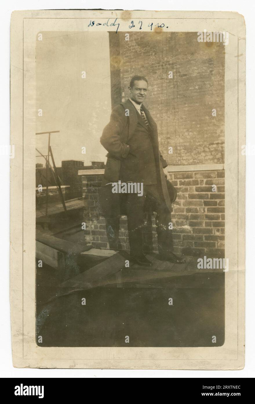 A black-and-white photograph of Lawrence McVey standing on the roof of ...