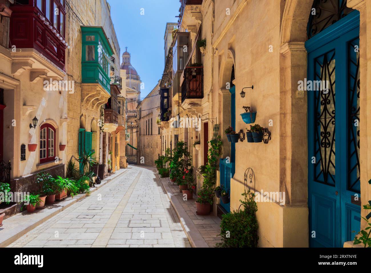 Traditional Maltese limestone buildings with coloured balconies in the ...