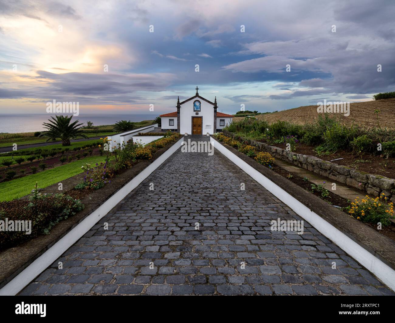 Cloudy sky at sunset over Ermida de Nossa Senhora do Pranto little ...