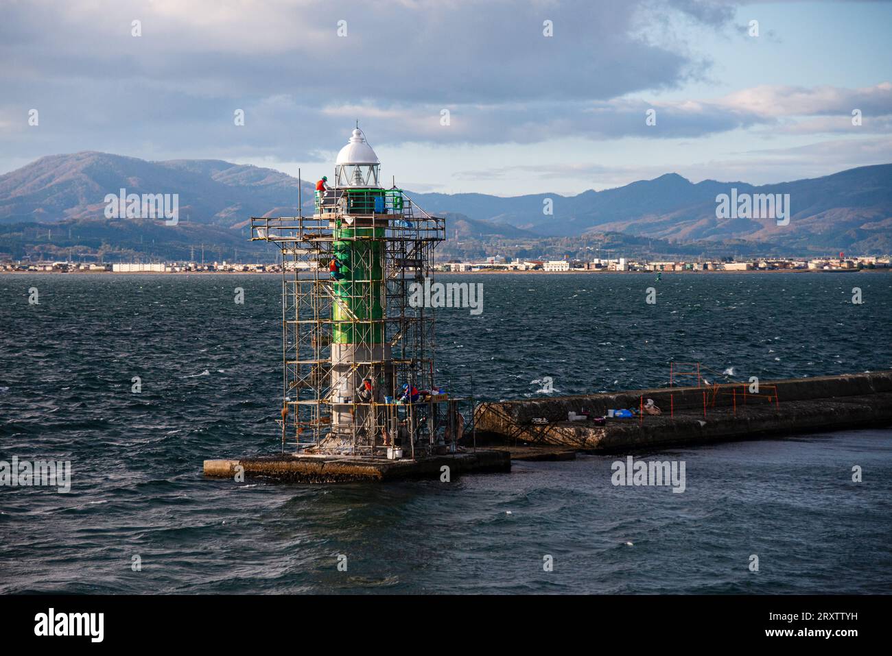 Green lighthouse being constructed in the sea of Hakodate, Hokkaido ...