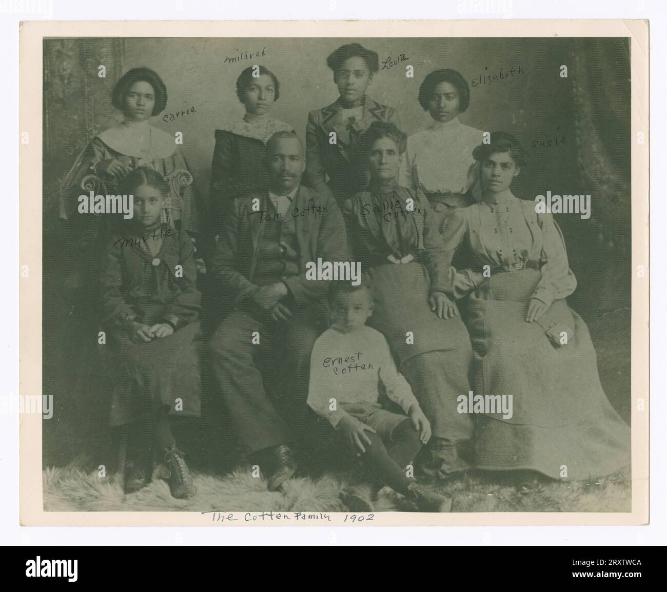 A black-and-white photograph of the nine members of the Cotten family ...