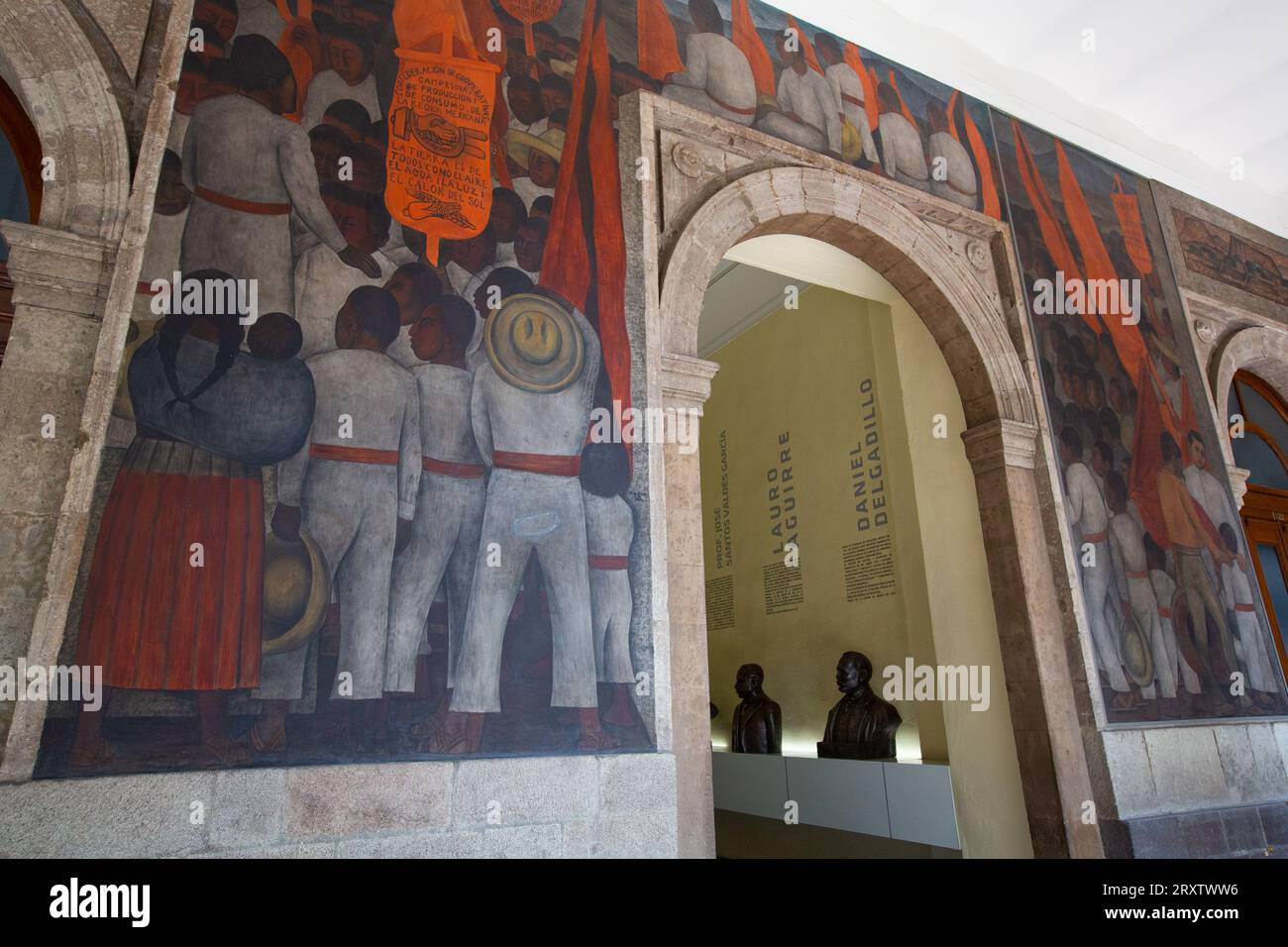 Entrance to Row of Busts of famous people, with murals by Diego Rivera ...