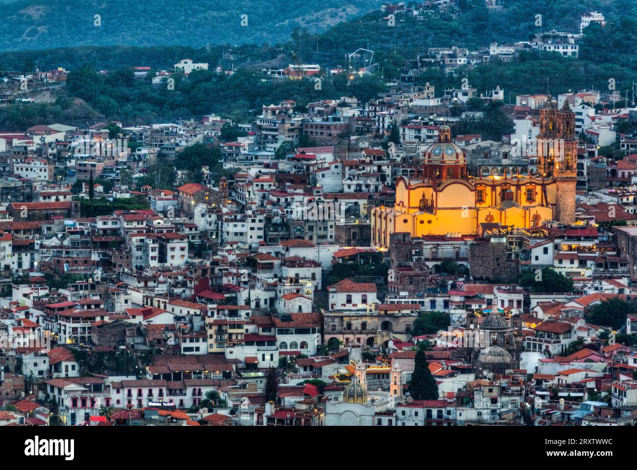 Evening overview, with illuminated Church of Santa Prisca de Taxco ...