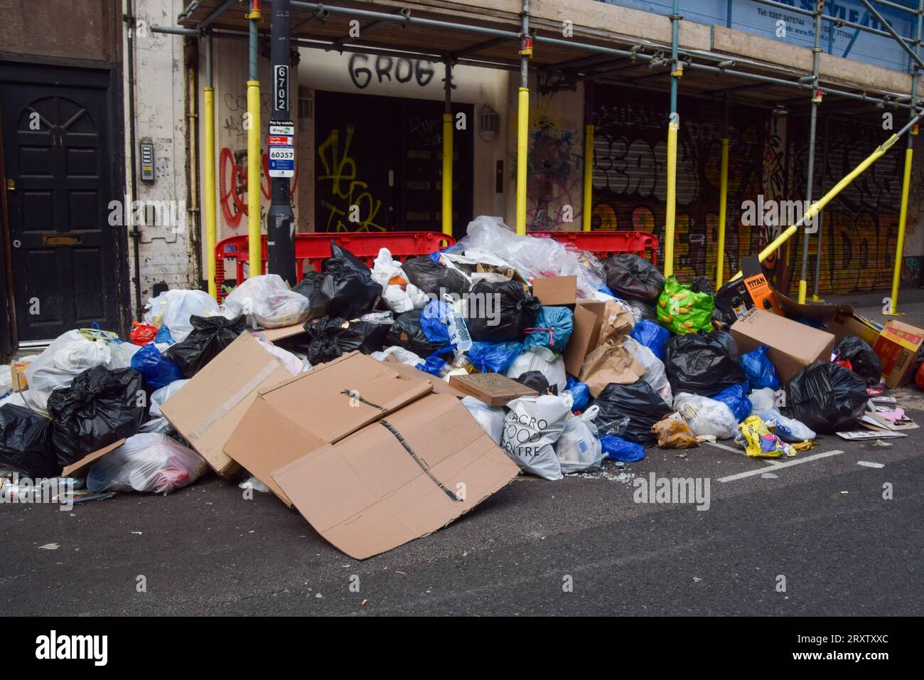 September 27, 2023, London, England, UK: Huge piles of garbage line the streets near Whitechapel ...