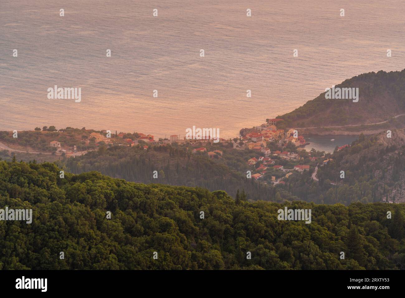 View of Assos, coastline, sea and hills at sunset, Assos, Kefalonia ...