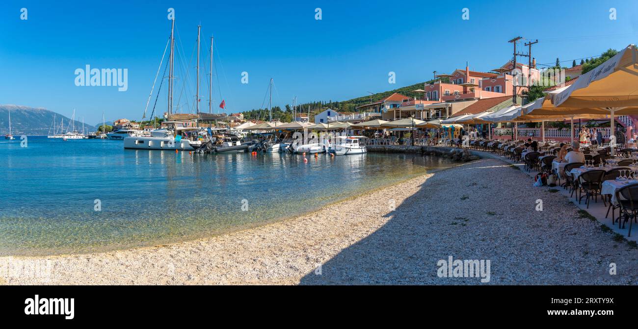 View of cafes and restaurants in Fiscardo harbour, Fiscardo, Kefalonia ...