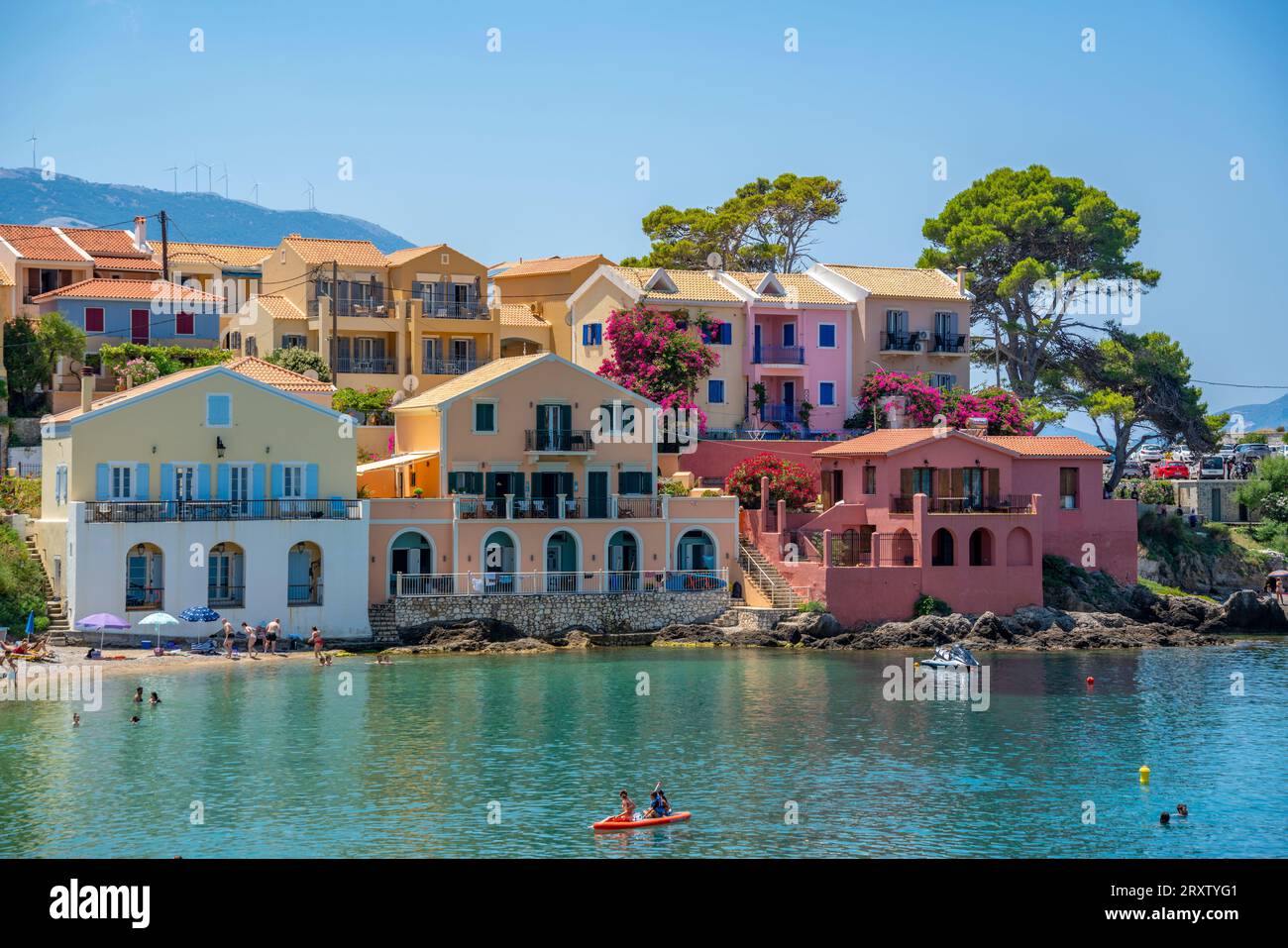 View of harbour and colourful houses in Assos, Assos, Kefalonia, Ionian ...