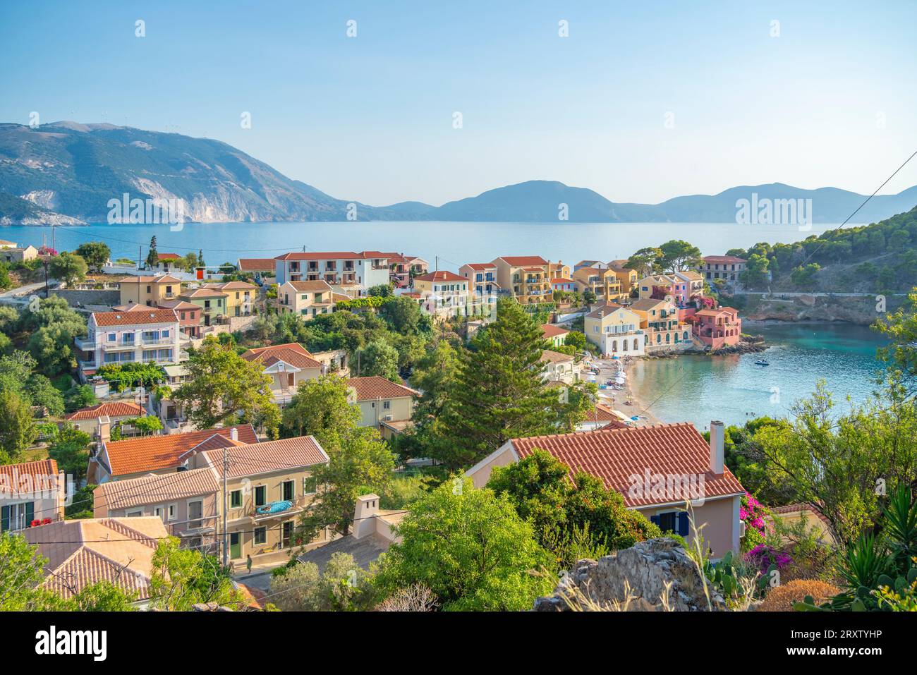 Elevated view of harbour and colourful houses in Assos, Assos ...