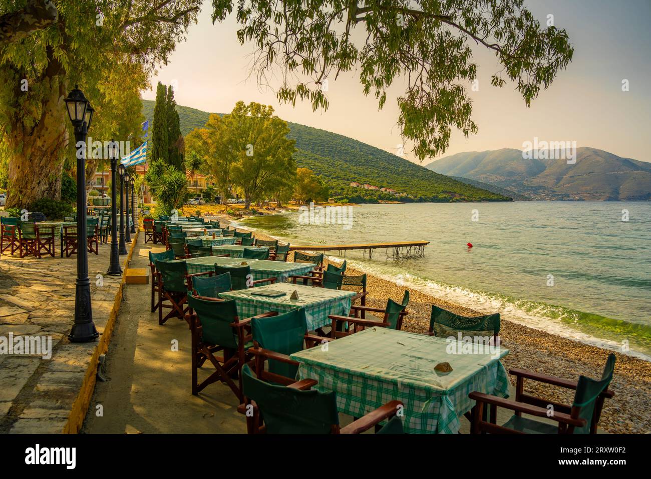 View of taverna tables at Karavomilos Lake in Sami, Sami, Kefalonia ...