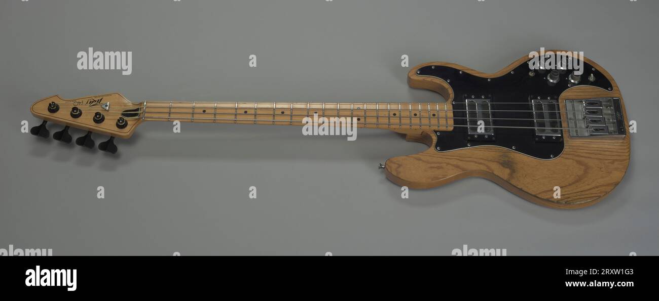 A Peavey T-40 bass guitar (2012.53.1a) and case (2012.53.1b) used by ...