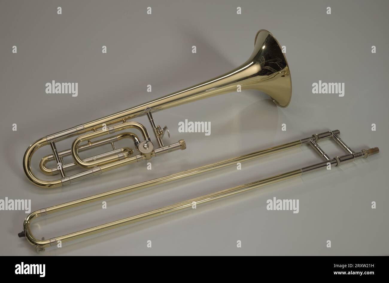This is a trombone and case, including the mouthpiece, innerslide, and ...