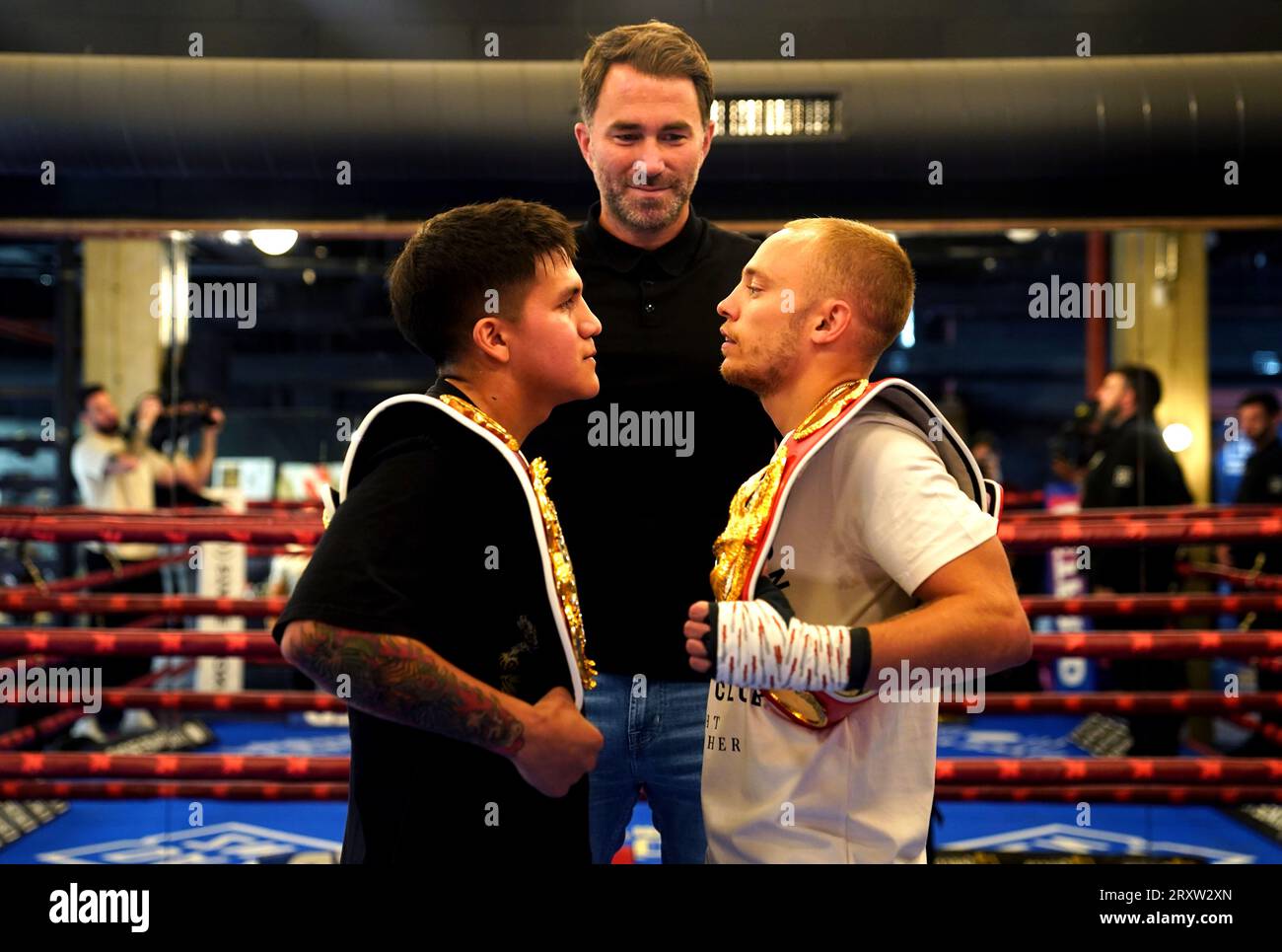 Boxing promoter Eddie Hearn (centre) with boxers Jesse Rodriguez (left ...