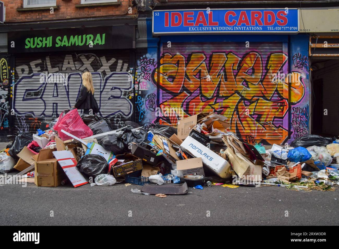 London, UK. 27th September 2023. Huge piles of garbage line the streets ...