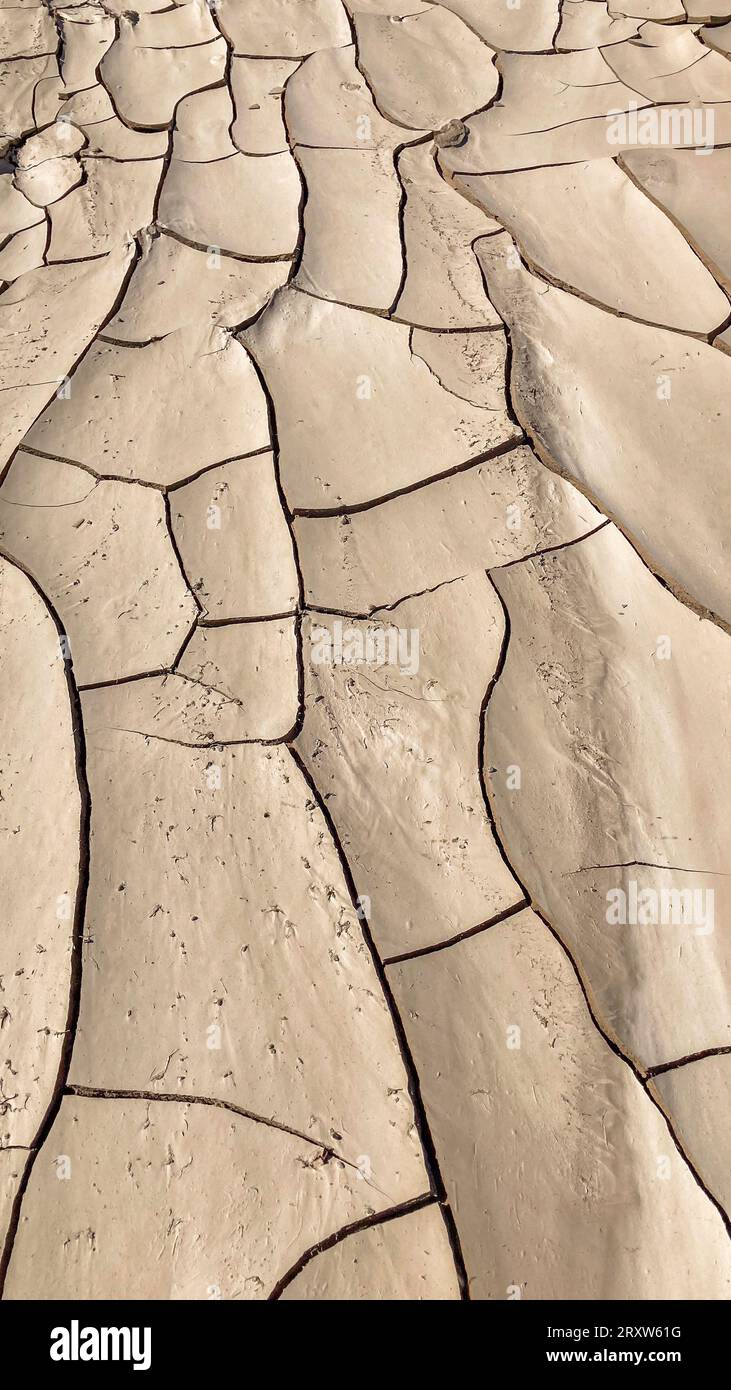 Abstract pattern of dry cracked clay mud surface, dried riverbed caused ...