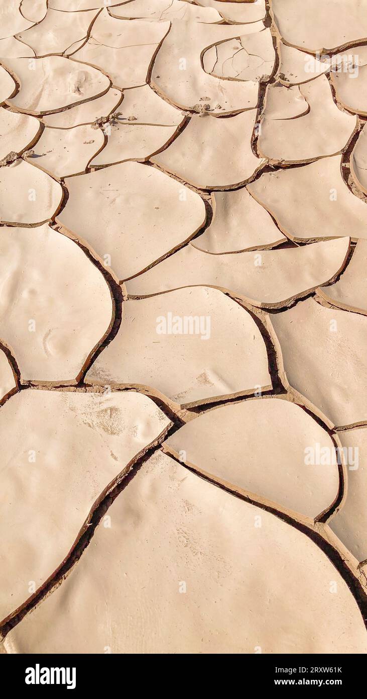 Abstract pattern of dry cracked clay mud surface, dried riverbed caused ...