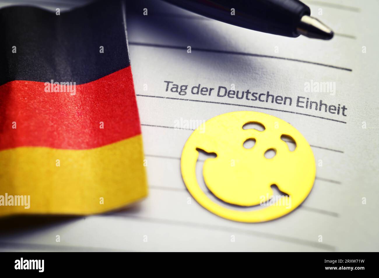 Kalenderseite Tag der Deutschen Einheit mit deutscher Fahne und Smiley ...
