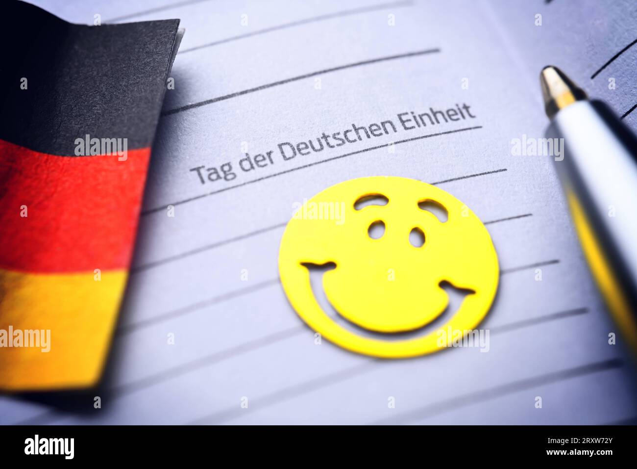 Kalenderseite Tag der Deutschen Einheit mit deutscher Fahne und Smiley ...