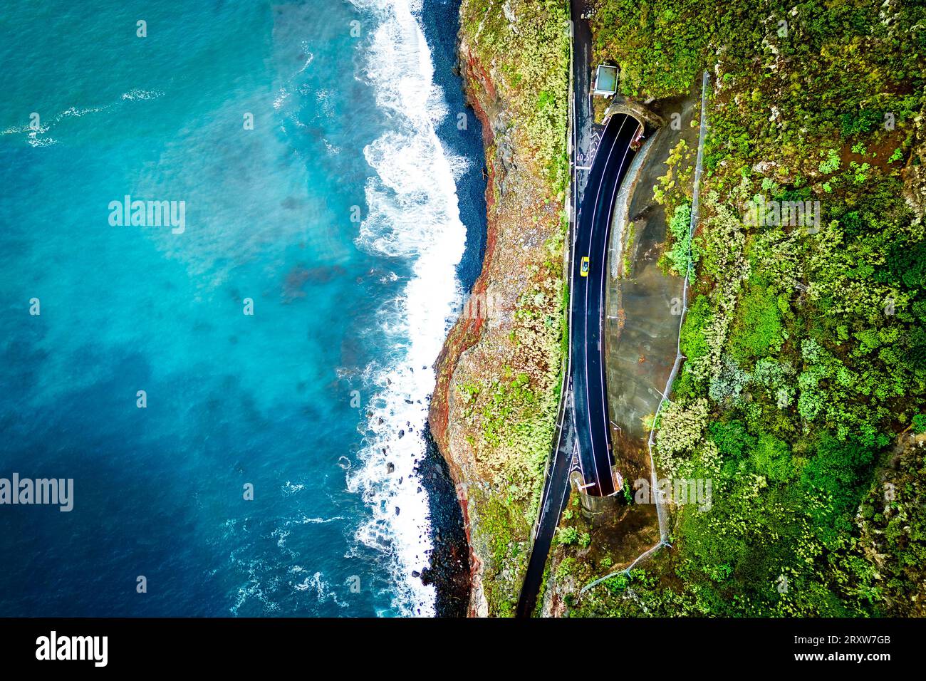 Beautiful and stunning bird's eye view of a yellow car driving between ...