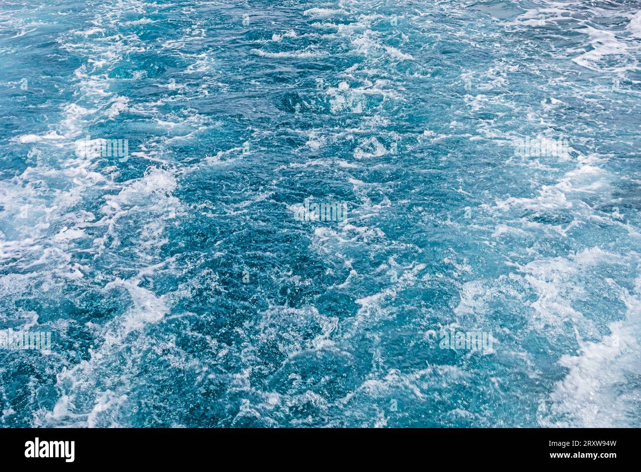 abstract background of sea water while the motor is moving in a boat ...