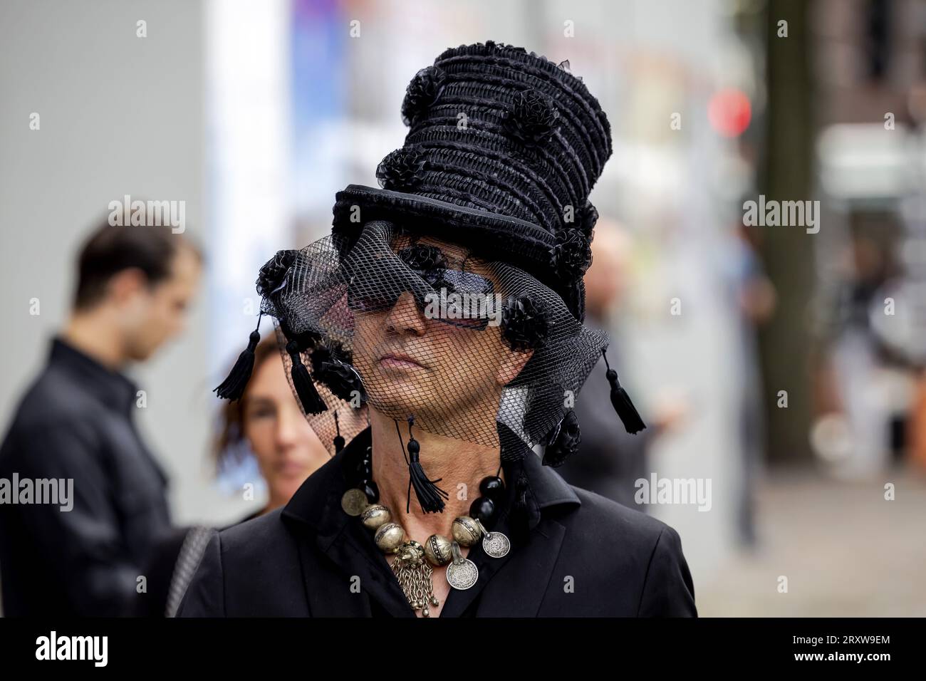 AMSTERDAM - A guest arrives at the Westerkerk for the funeral service ...