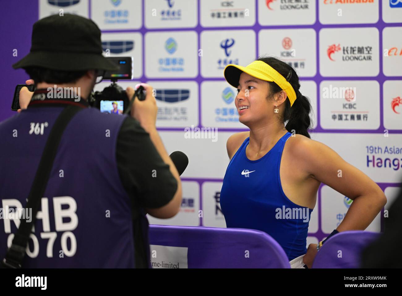Alex Eala (R) of the Philippines is seen during the 19th Asian Games ...
