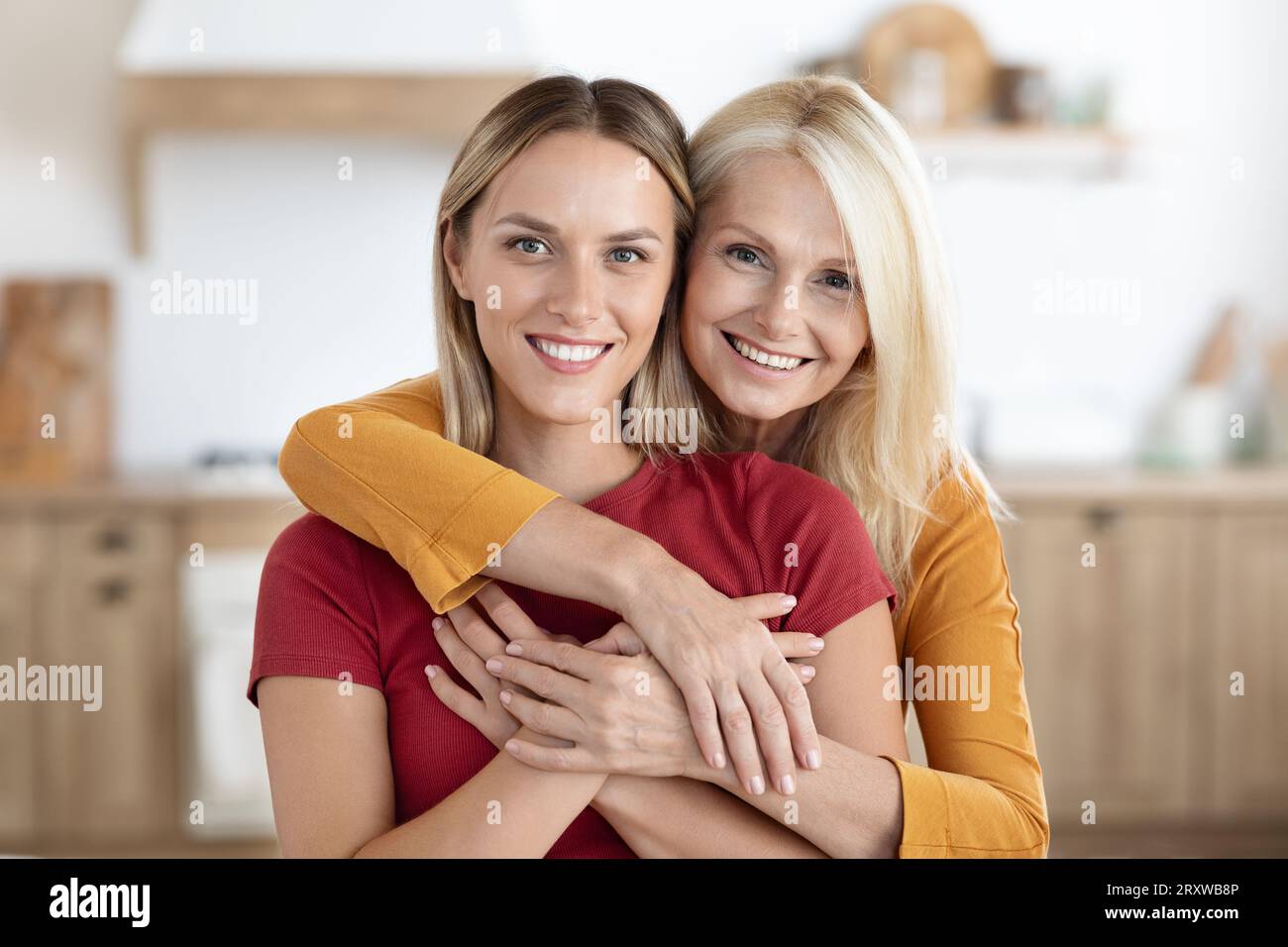 Adult daughter hugging senior mum hi-res stock photography and images - Alamy