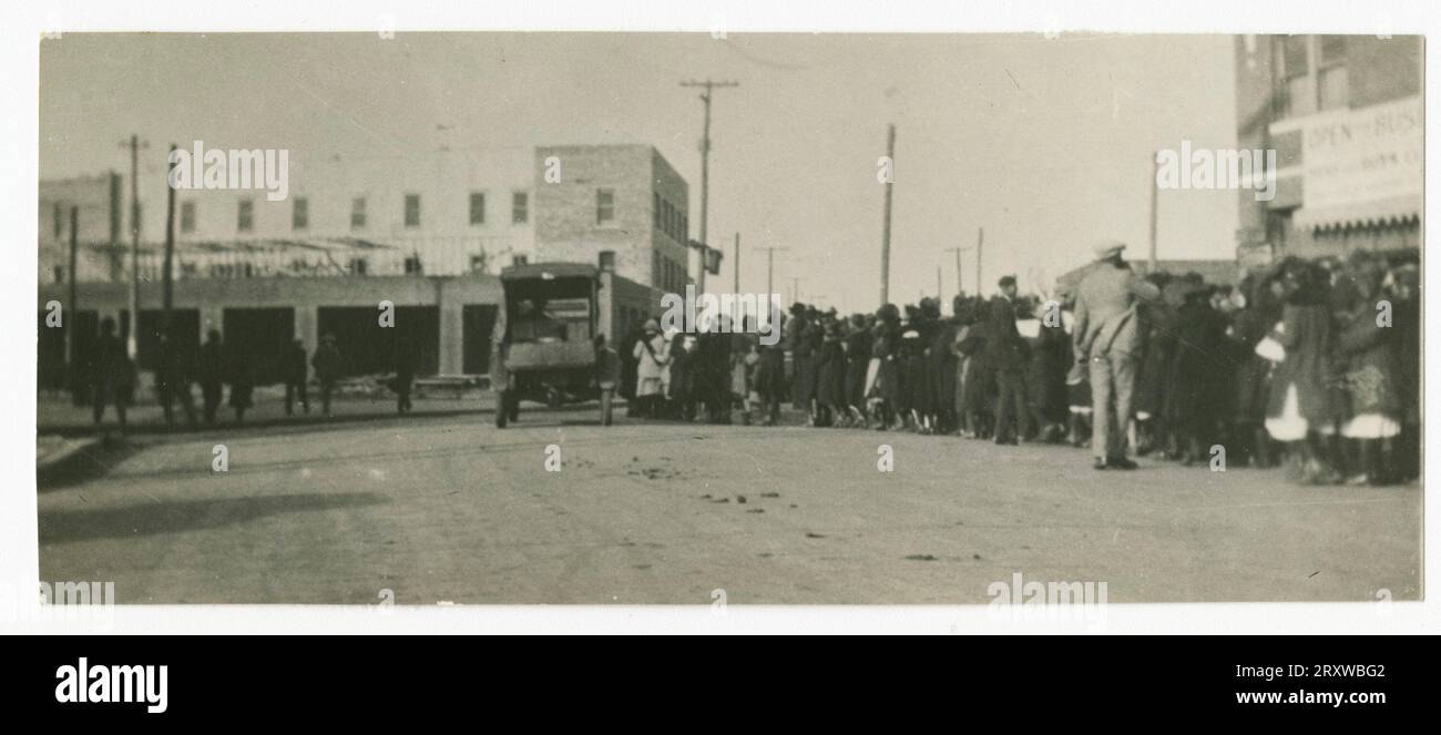 Photograph of people standing in a line on a street in Tulsa, Oklahoma ...