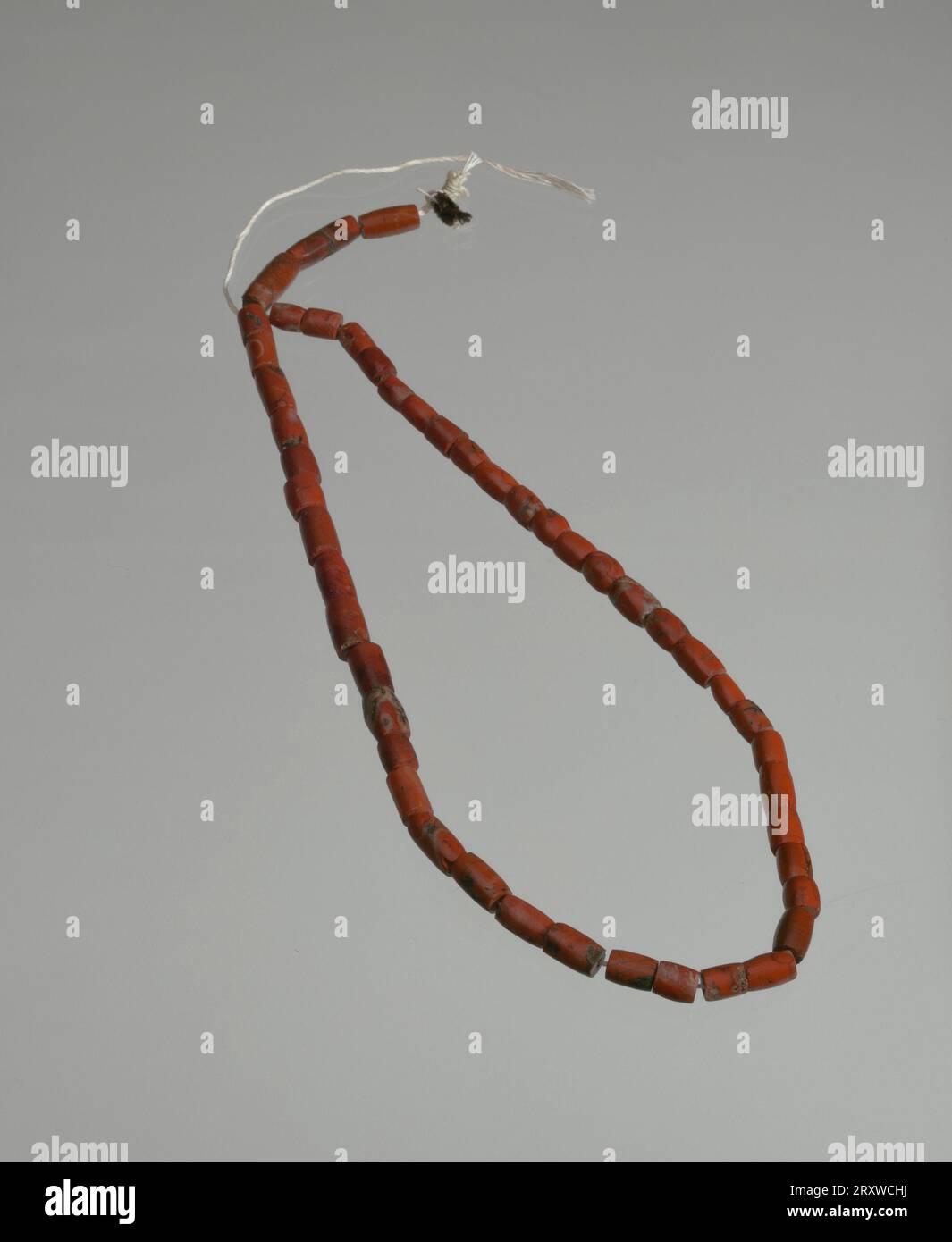 String of small coral beads 1800-1968 Stock Photo - Alamy