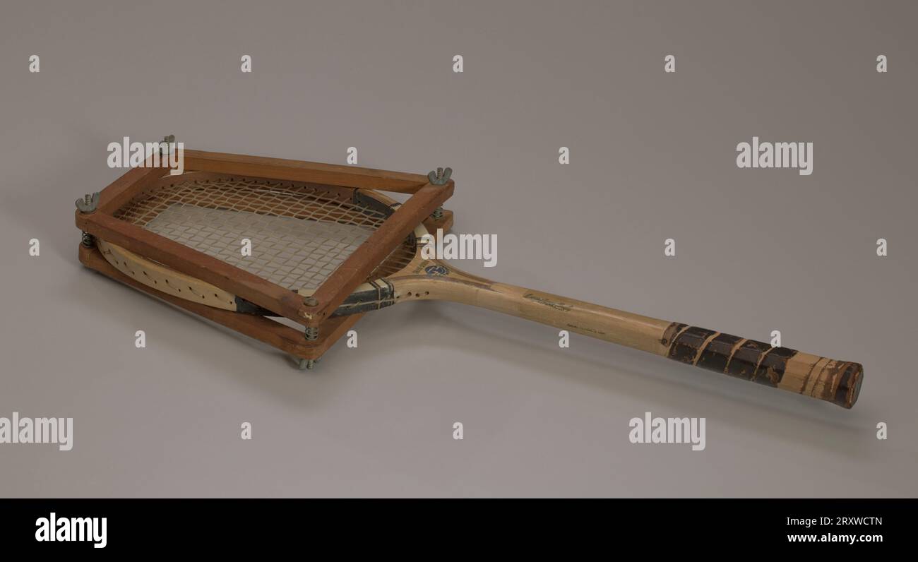 A tennis racquet owned by Althea Gibson. The racquet is made of wood ...
