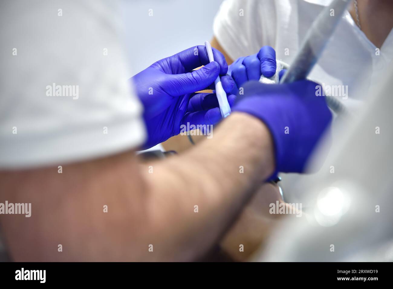 Dentist Surgeon Performing Operation Install Dental Implant Teeth Of ...