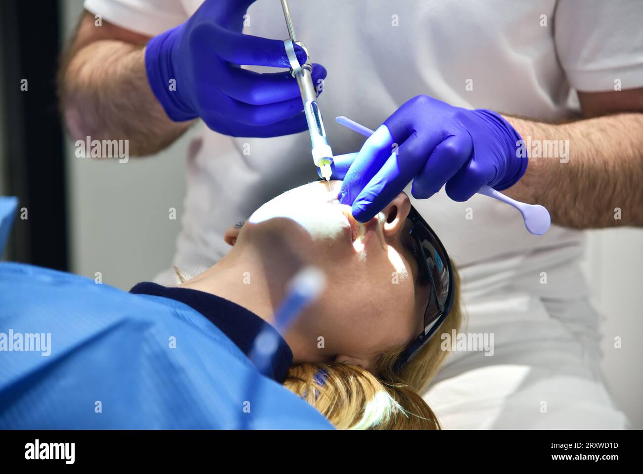 dentist makes an injection of anesthesia to a patient Stock Photo - Alamy