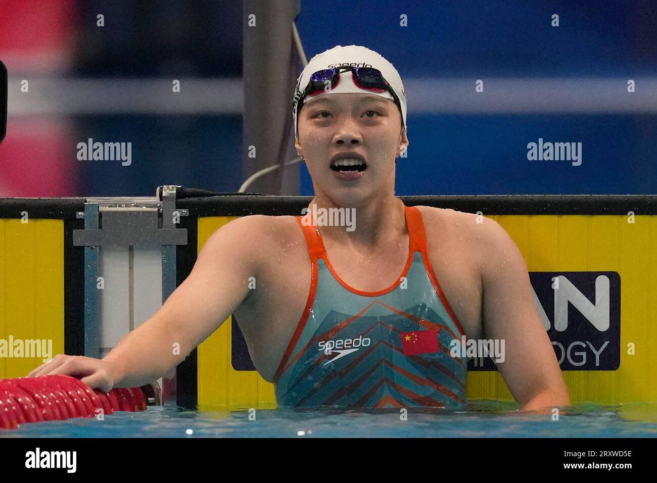 China's Wan Letian reacts after winning the women's 100m backstroke swimming final at the 19th ...