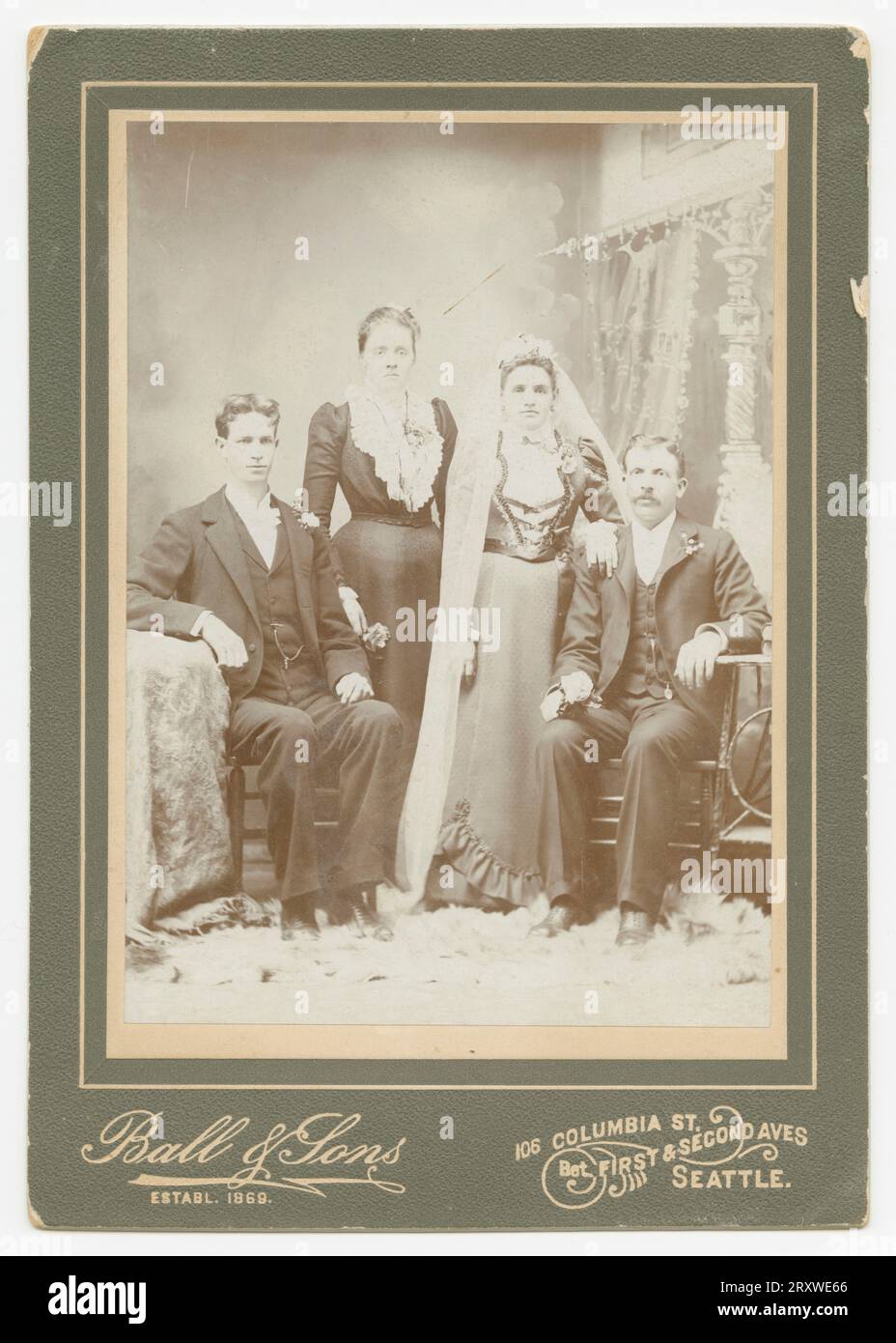 A black-and-white photograph of a wedding party photographed at the ...