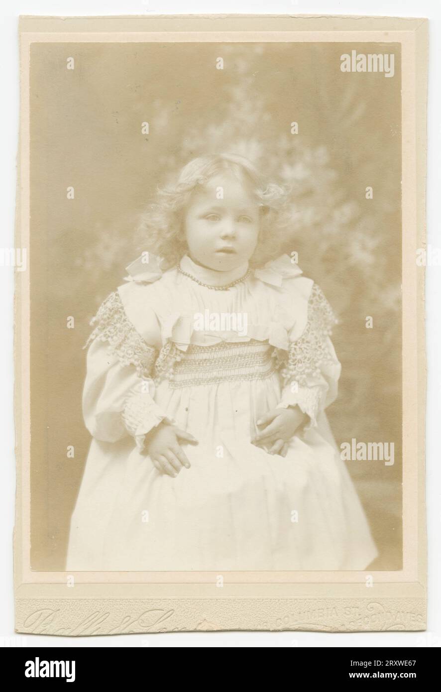 A black-and-white photograph of a small child photographed at the Ball ...