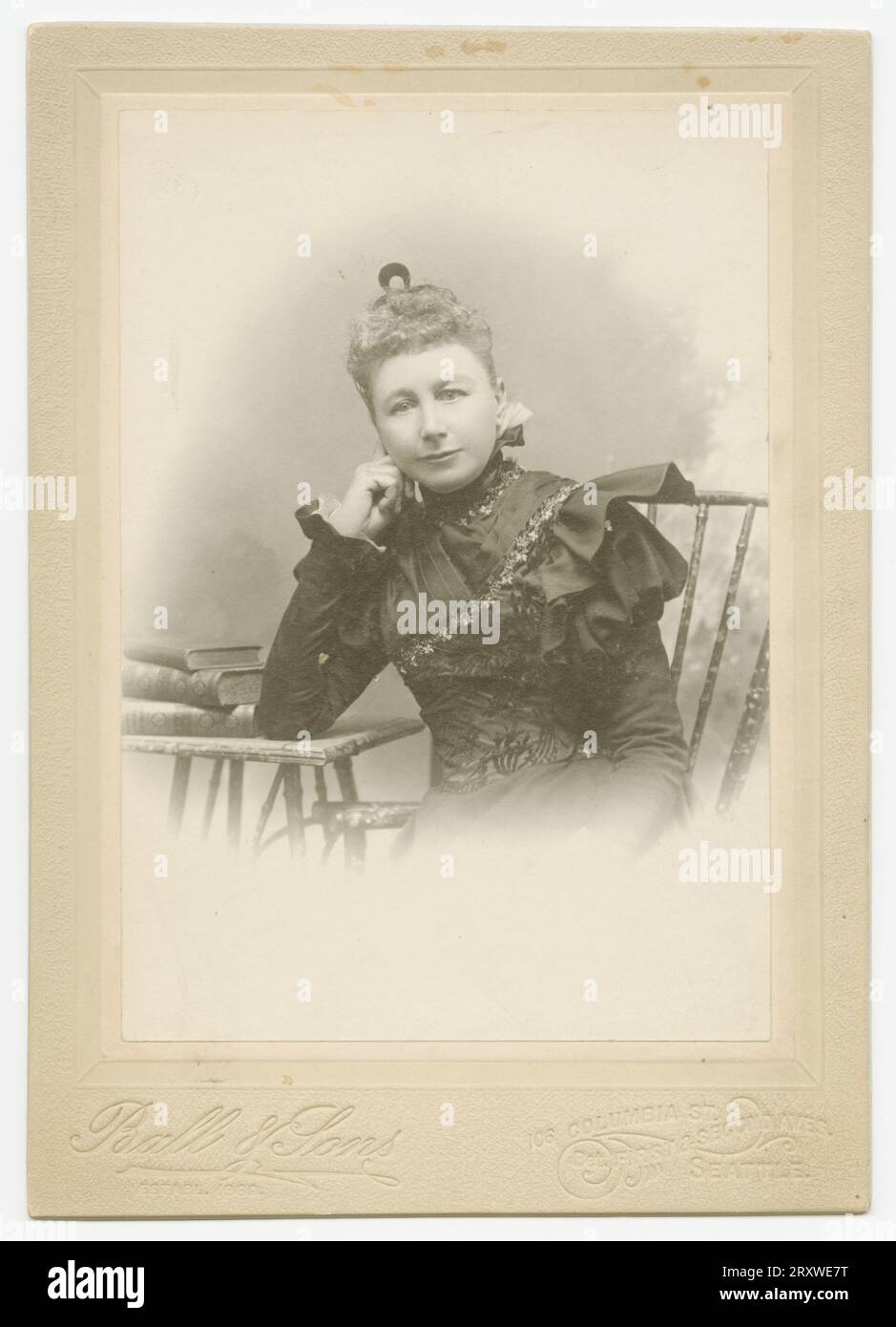 A black-and-white photograph of a woman photographed at the Ball & Sons ...