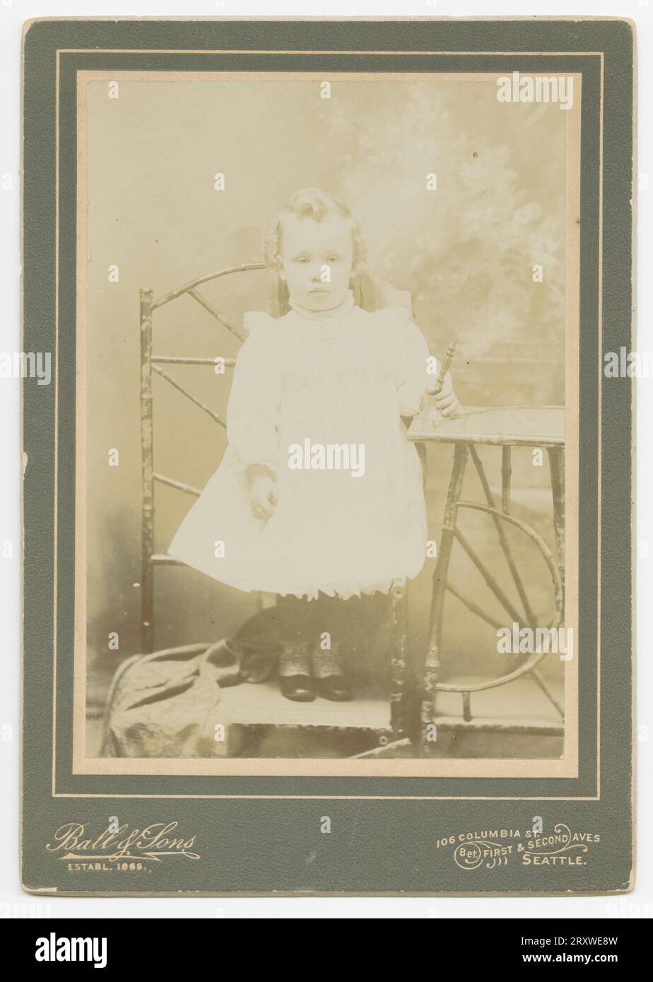 A black-and-white photograph of a small child photographed at the Ball ...