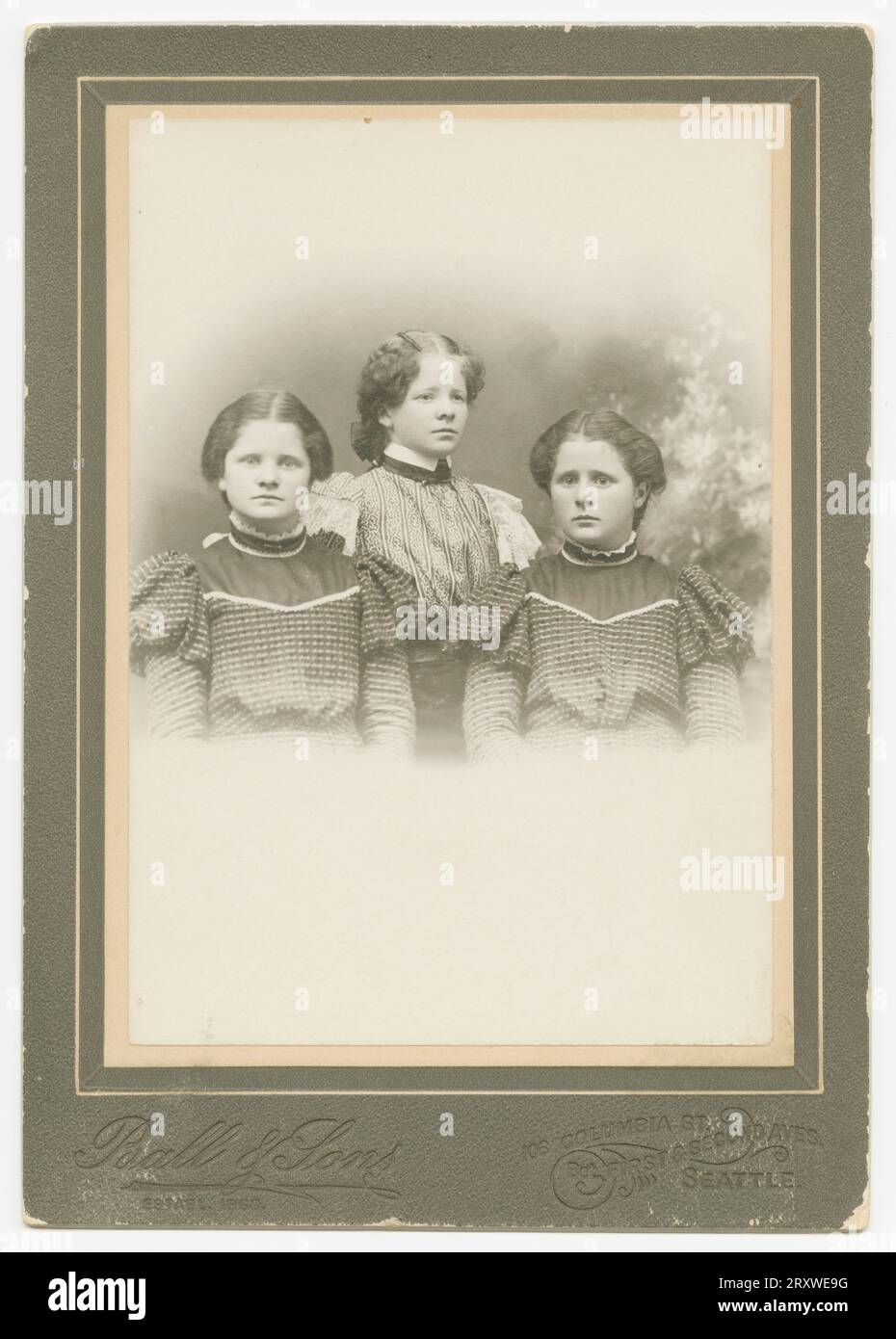 A black-and-white photograph of three girls photographed at the Ball ...