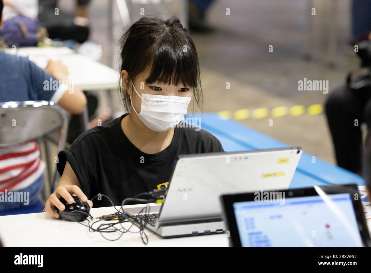 Participant of a video game programming workshop for kids solves an ...