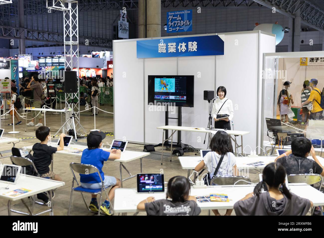 Facilitator of a sound design workshop for kids gives her explanations ...
