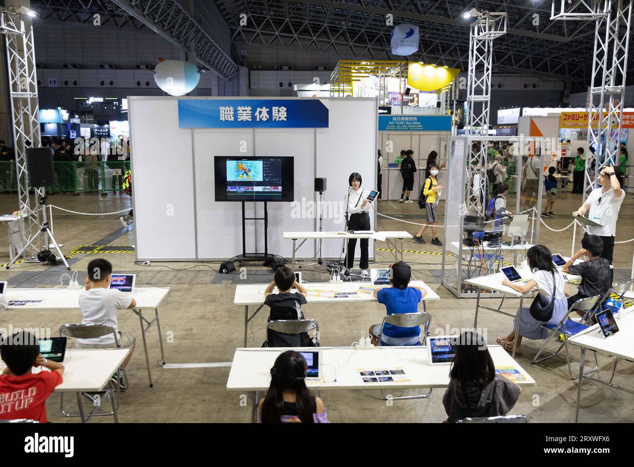 Facilitator of a sound design workshop for kids gives her explanations ...