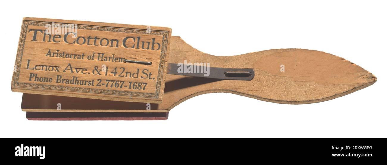 This is a wood clapper instrument with black etched type on front and ...