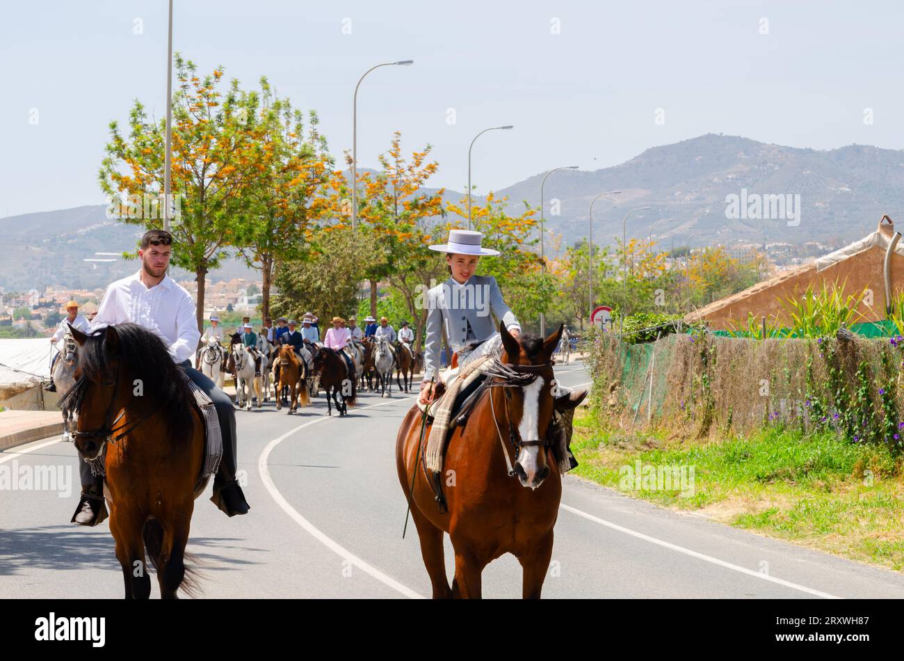 NERJA, SPAIN - 15 MAY 2022 Women in flamenco dresses and men on ...