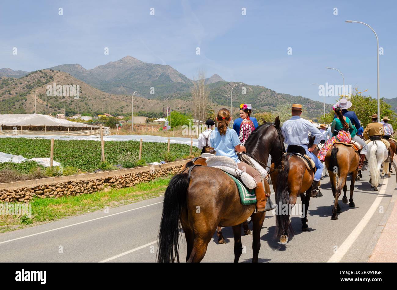 NERJA, SPAIN - 15 MAY 2022 Women in flamenco dresses and men on ...