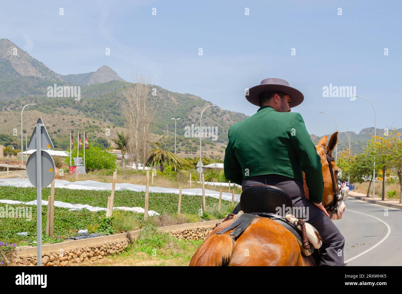 NERJA, SPAIN - 15 MAY 2022 Women in flamenco dresses and men on ...