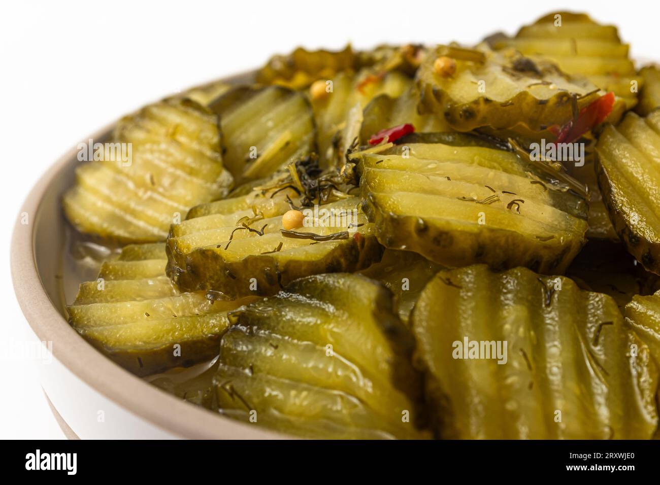 Dill pickles on a white background Stock Photo - Alamy