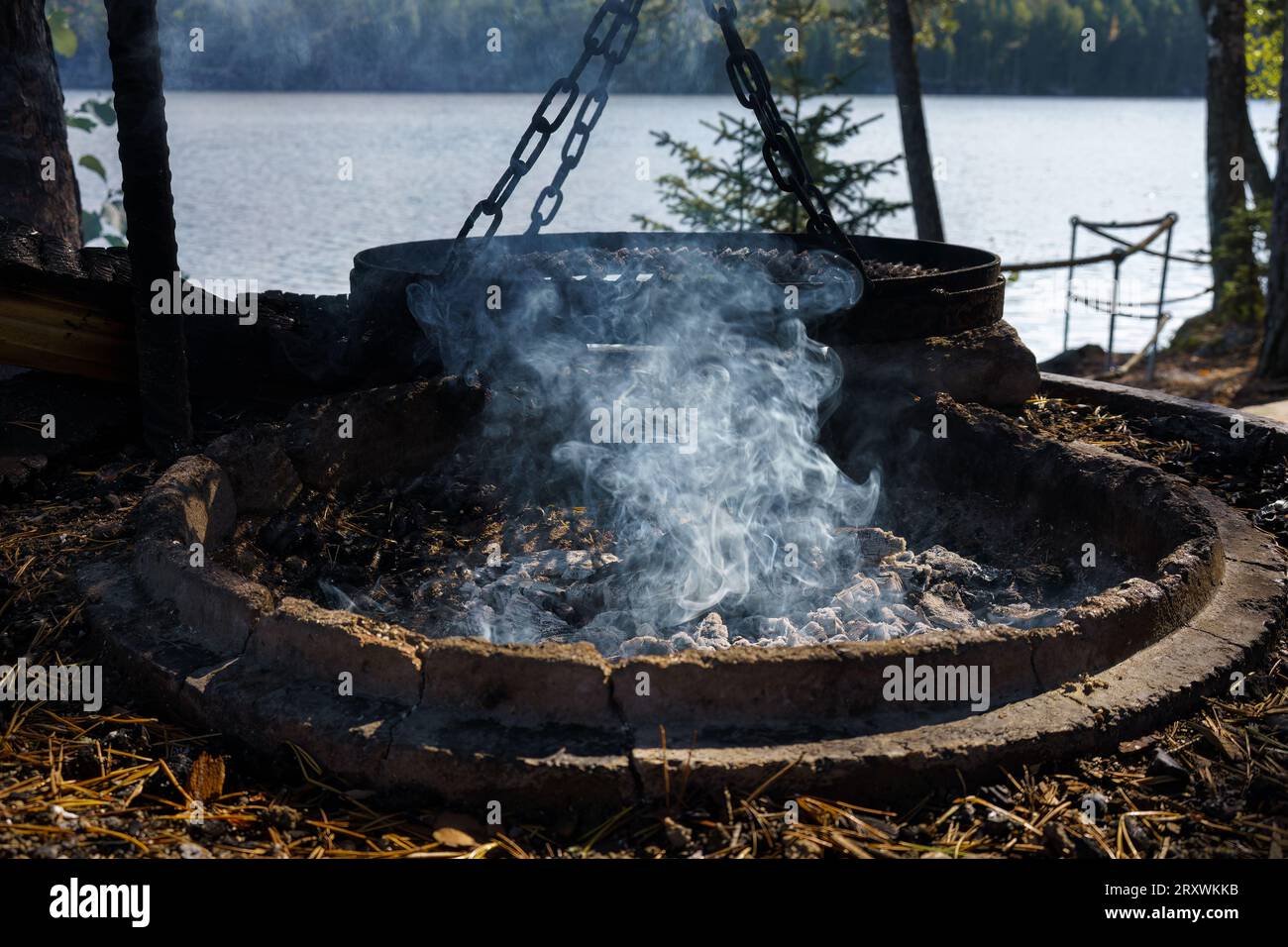Smoking campfire, fire pit in Lapakisto Nature Reserve, Lahti, Finland ...