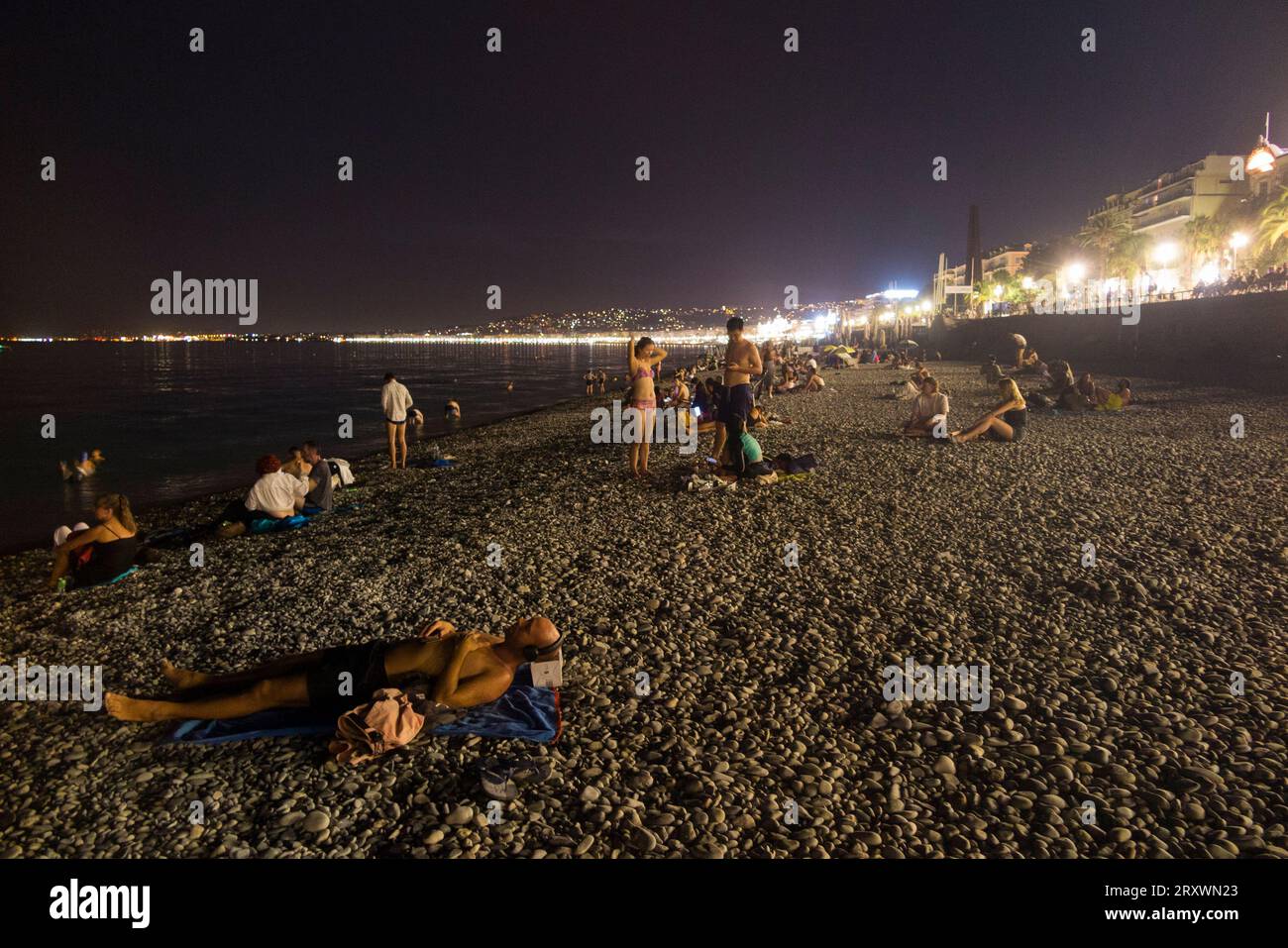 Bathers and sun bathers stay on the beach at Nice in France after ...