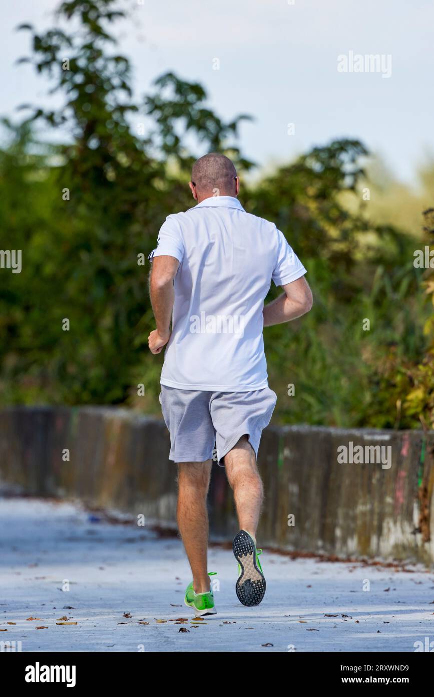 Business man running from behind hi-res stock photography and images ...