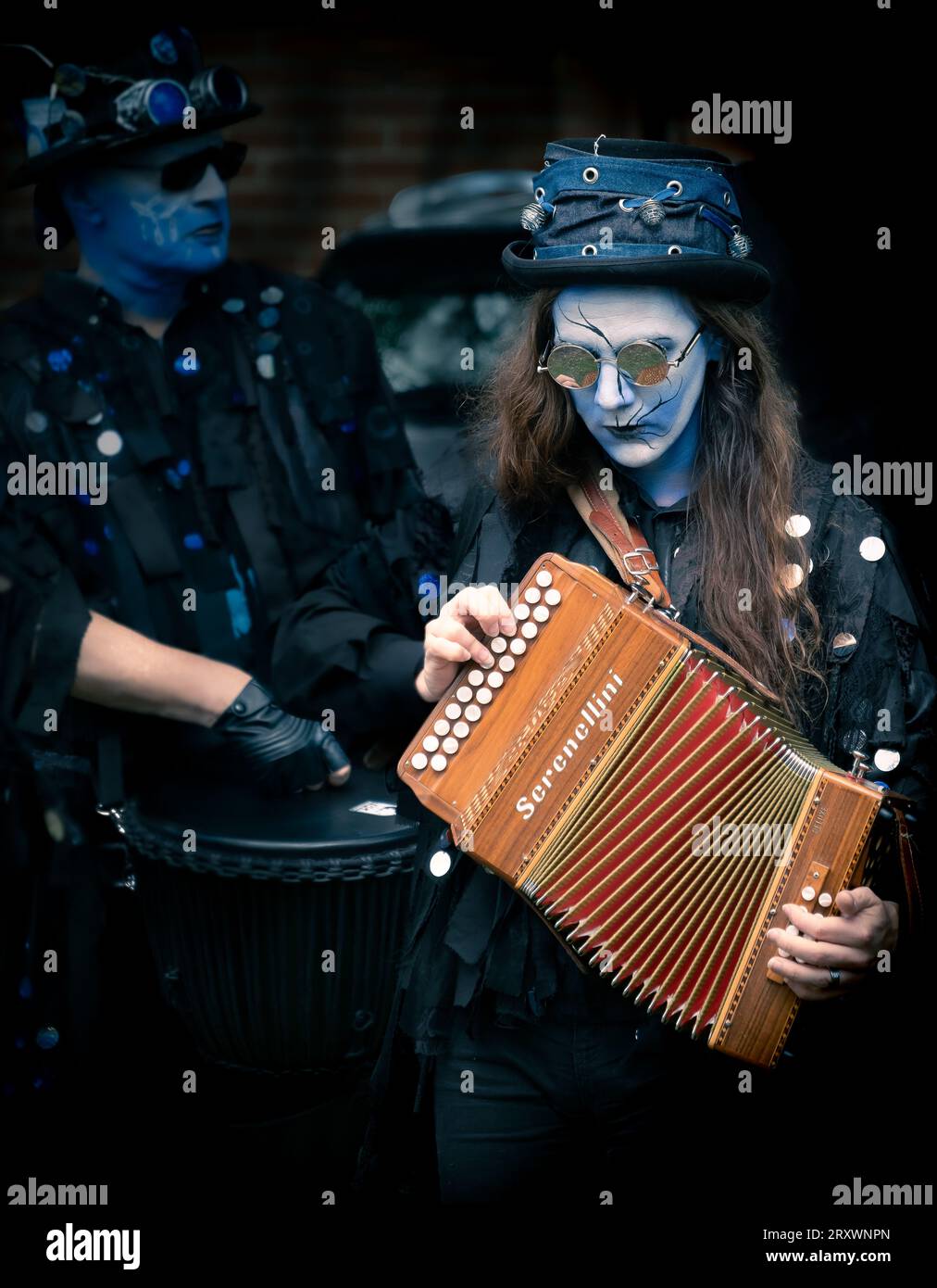 Morris Dancers with full makeup and painted faces and playing an ...