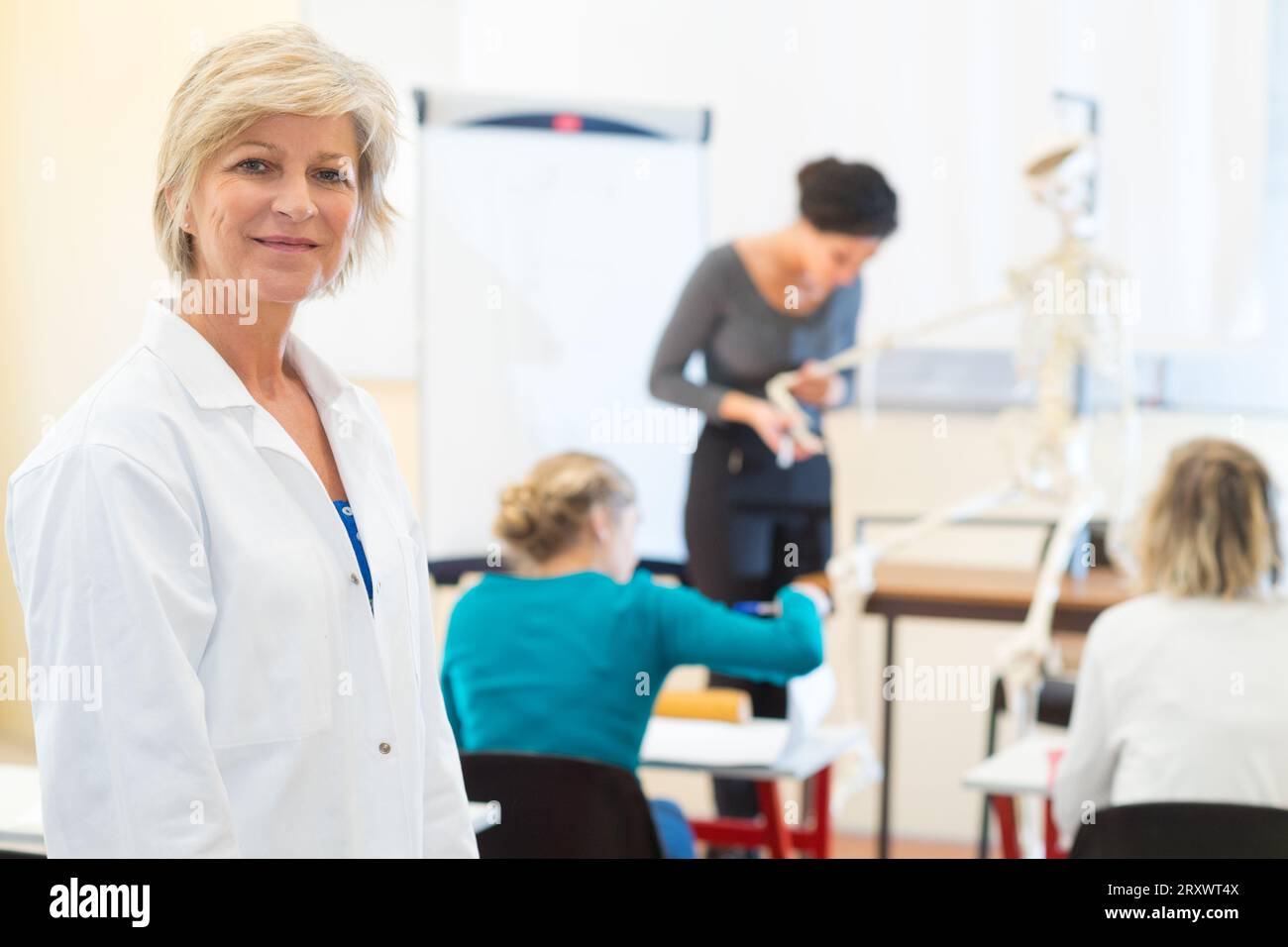 female professional chiropractor and her students Stock Photo - Alamy